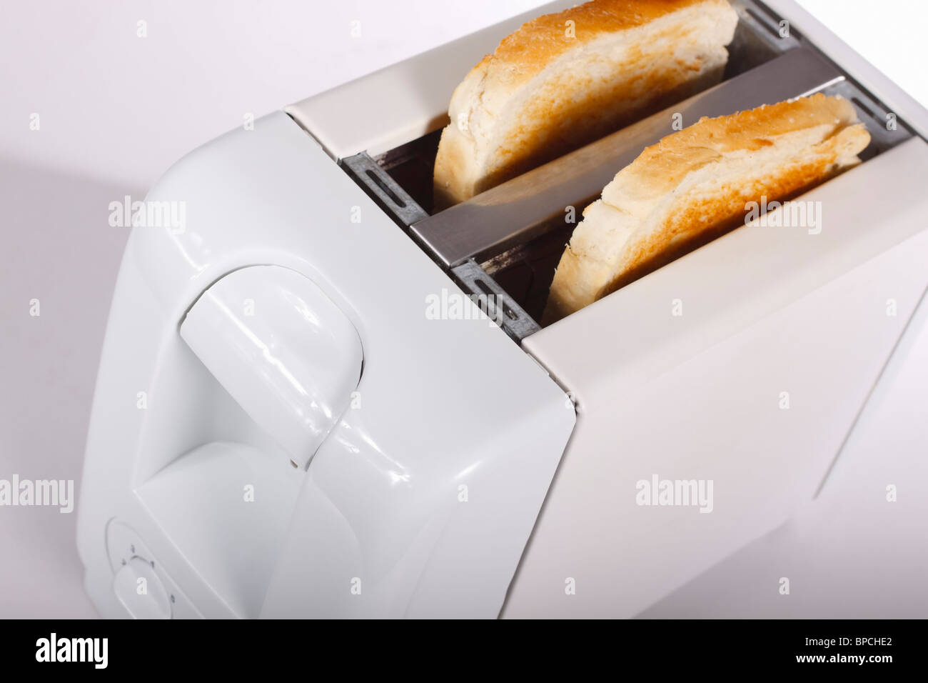 White toaster with two slices of toast. Isolated Stock Photo - Alamy