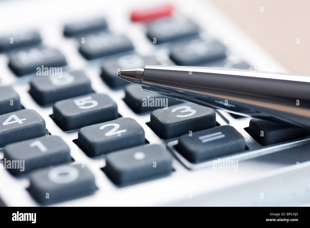 calculator and pen Stock Photo - Alamy
