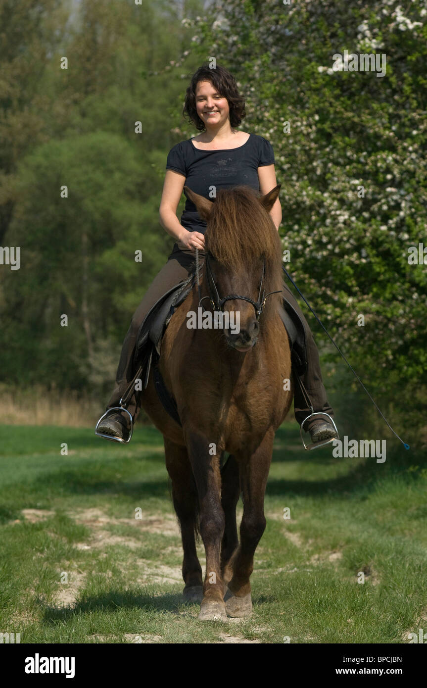 woman rides pony Stock Photo - Alamy