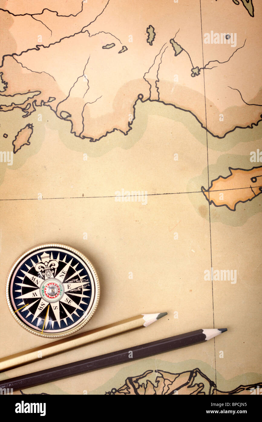 Compass and pencils on the old map Stock Photo - Alamy