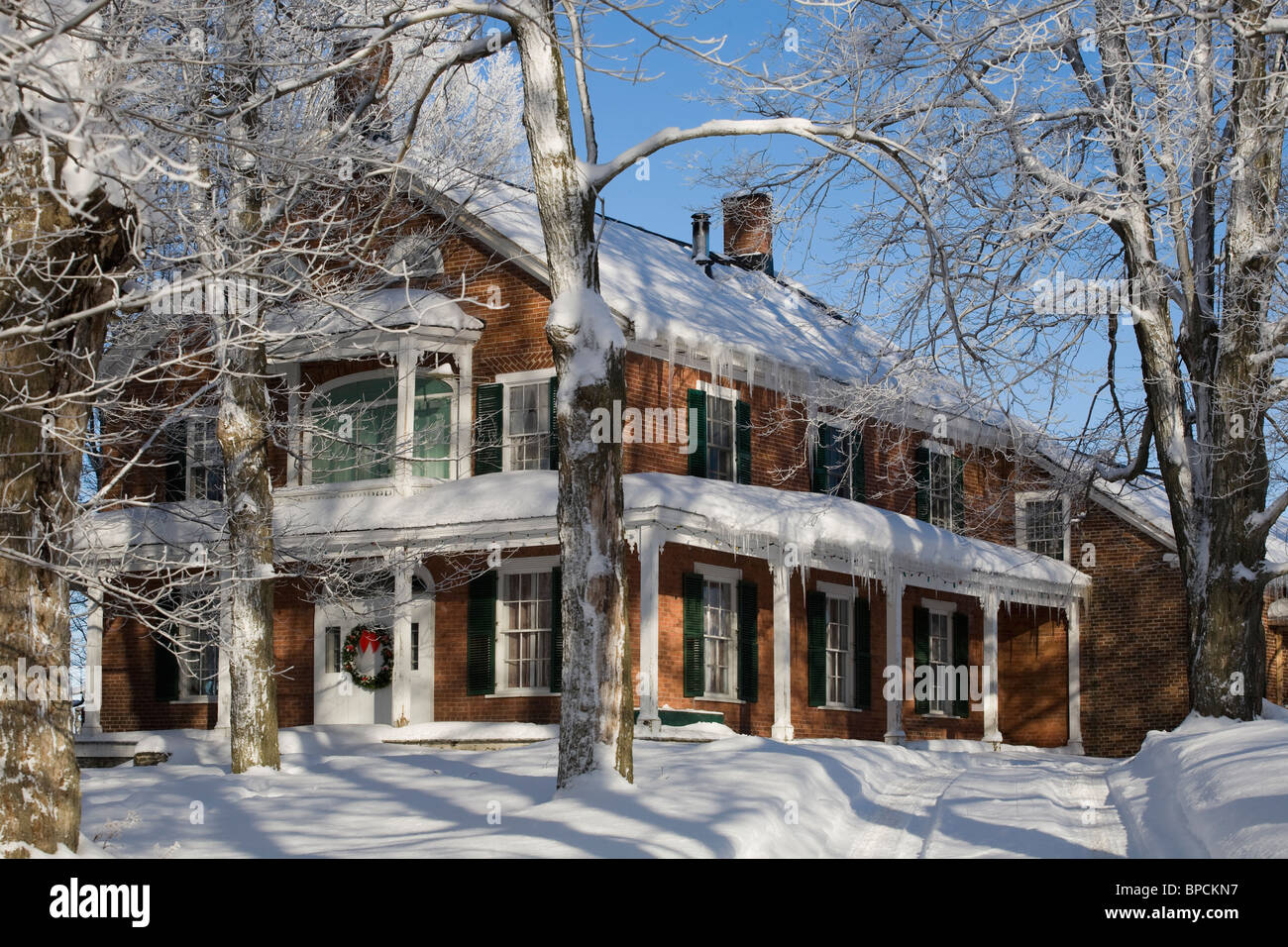 waterloo, quebec, canada; a house covered in snow in the winter Stock ...