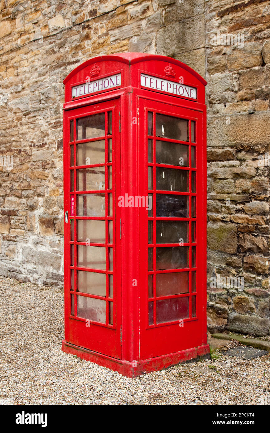 British red telephone box against stone building, Blanchland ...