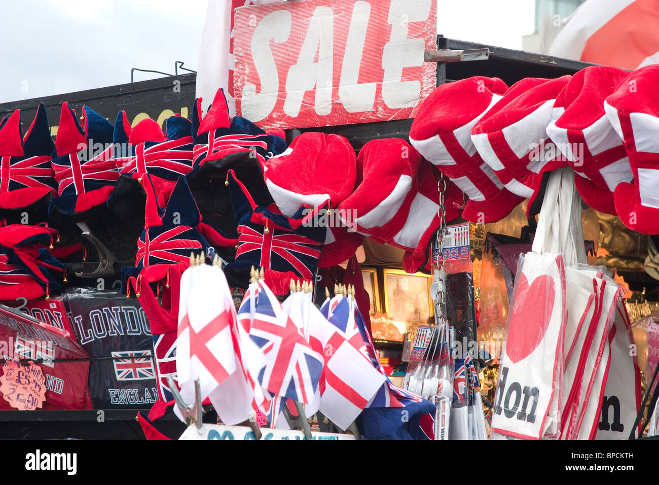 tourist gift stall sale sign London flags hats bag Stock Photo - Alamy