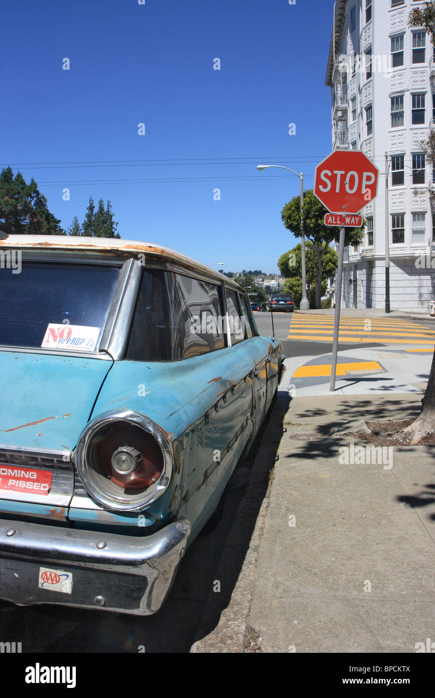 A rusting classic car parked at an intersection, San Francisco, USA ...