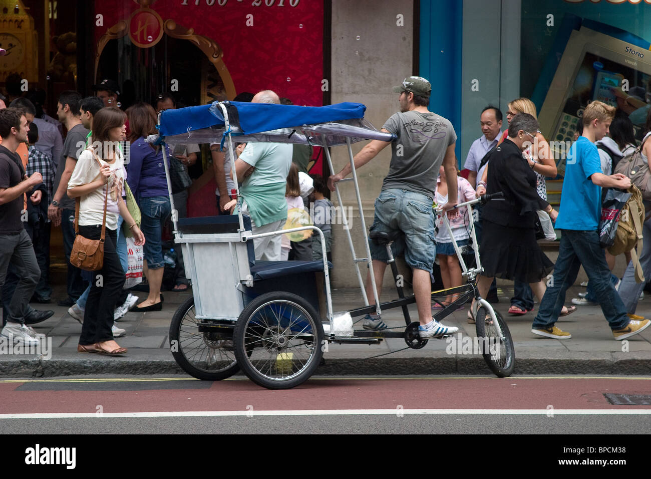 public transport London rickshaw pedicab tricycle Stock Photo - Alamy