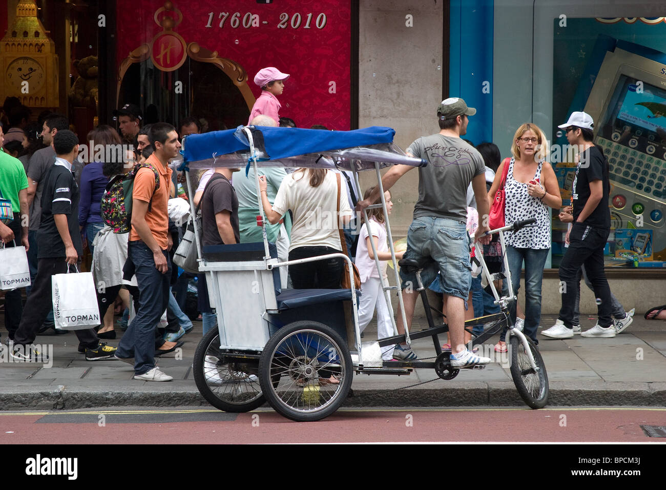 public transport London rickshaw pedicab tricycle Stock Photo - Alamy