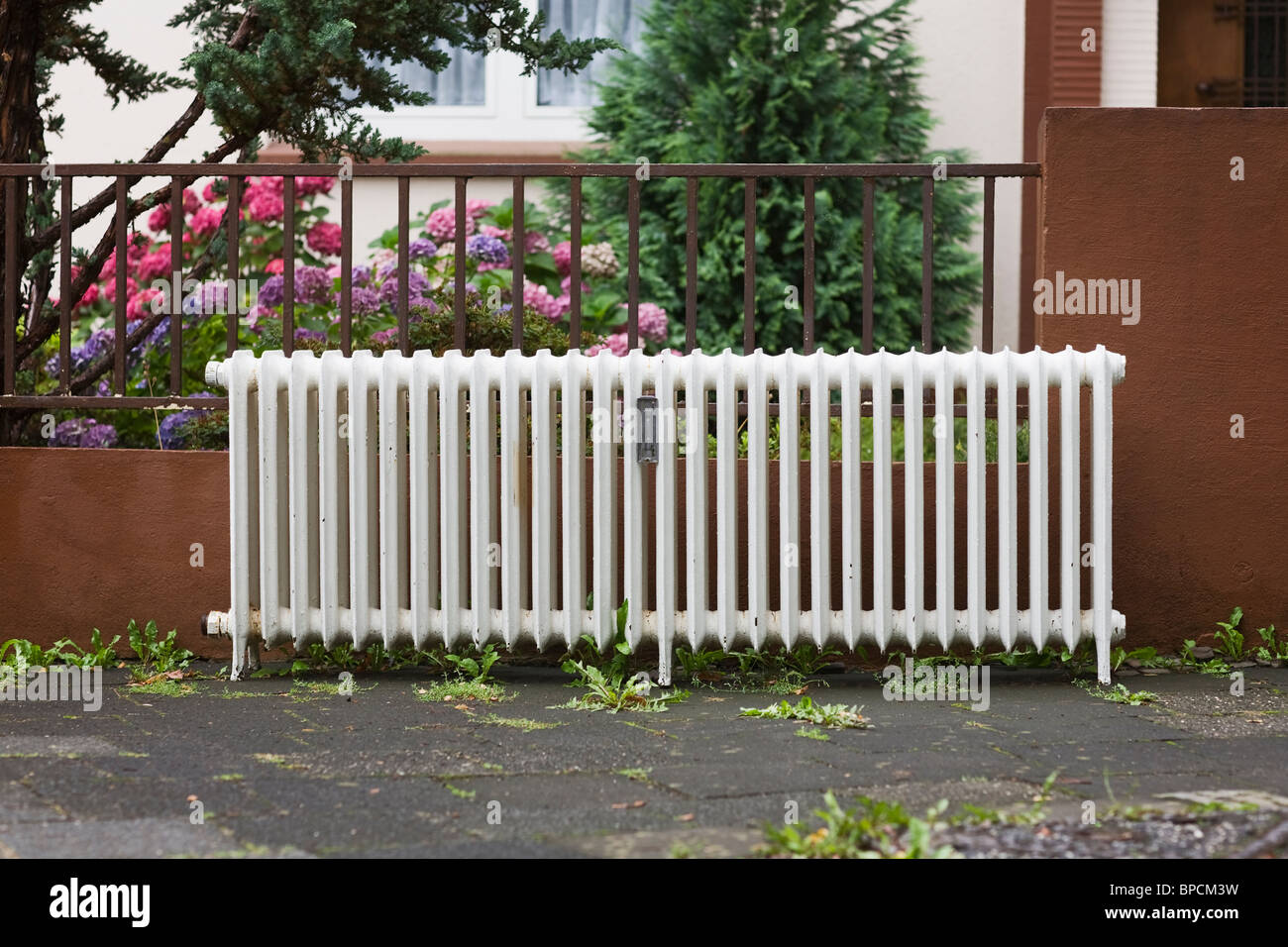 Old heating radiator outside building Stock Photo - Alamy