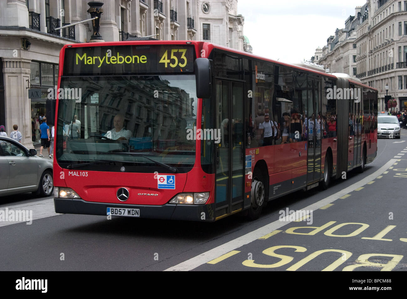 red bendy bus window bus public transport stop Stock Photo - Alamy