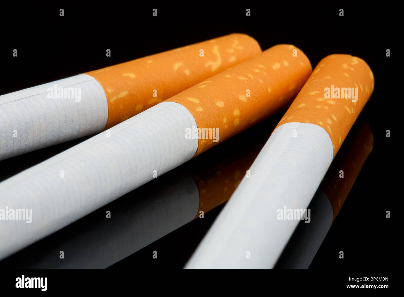 Three Cigarettes On Black Reflective Background Studio Close Up Shot ...