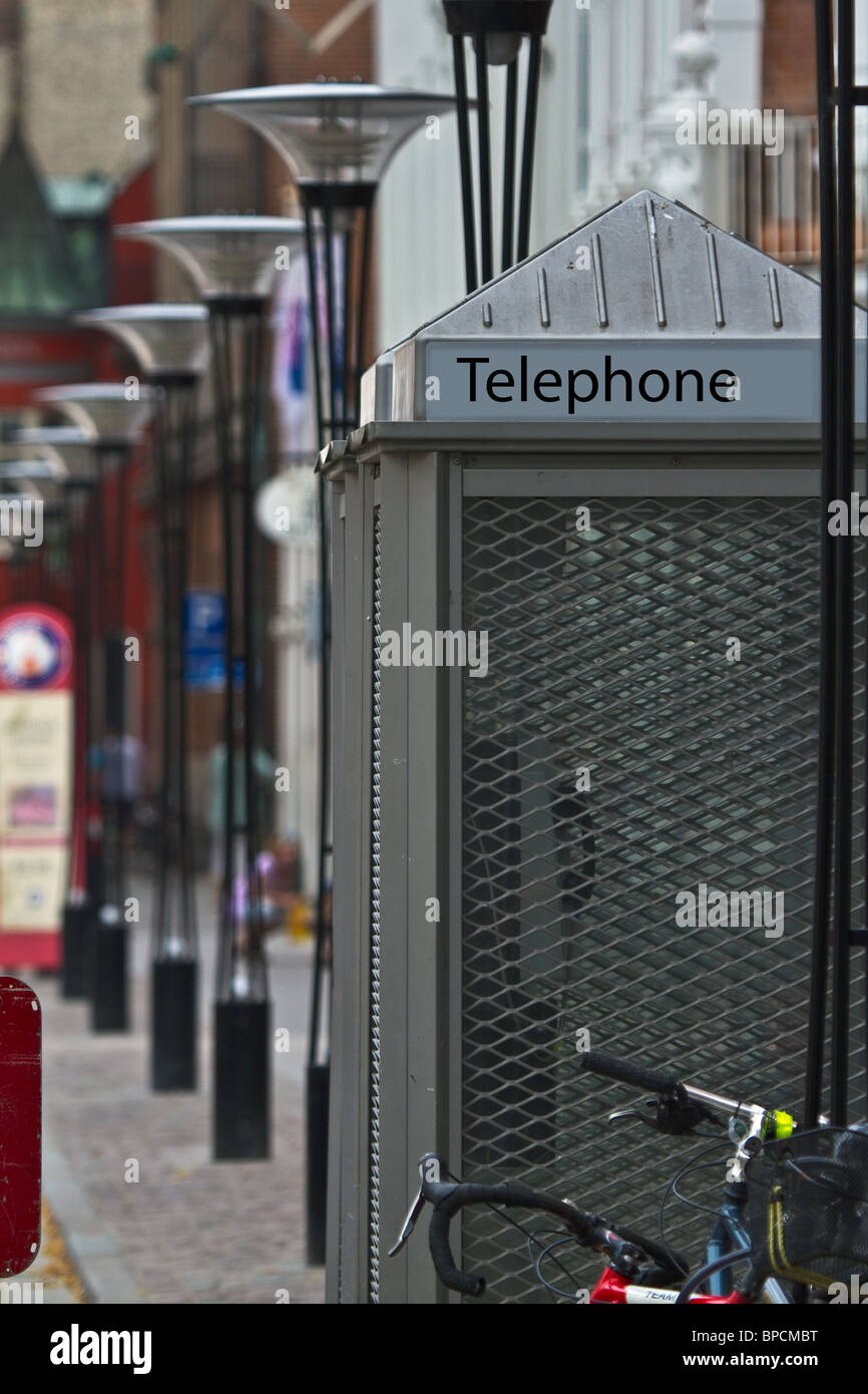 Aarhus, Denmark. Typical telephone booth and street light. Portrait ...