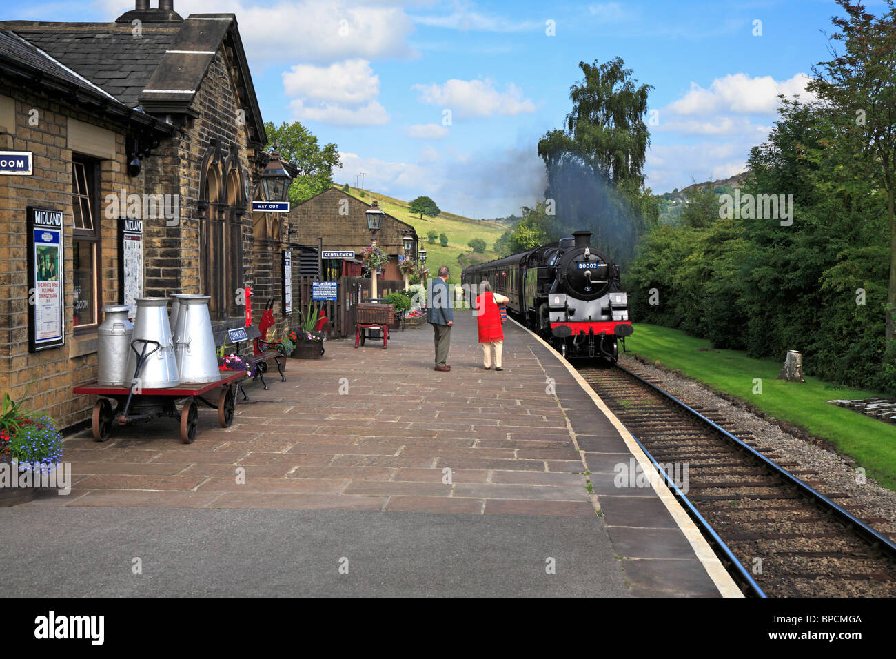 Steam train arriving at Oakworth Railway Station, Keighley and Worth ...