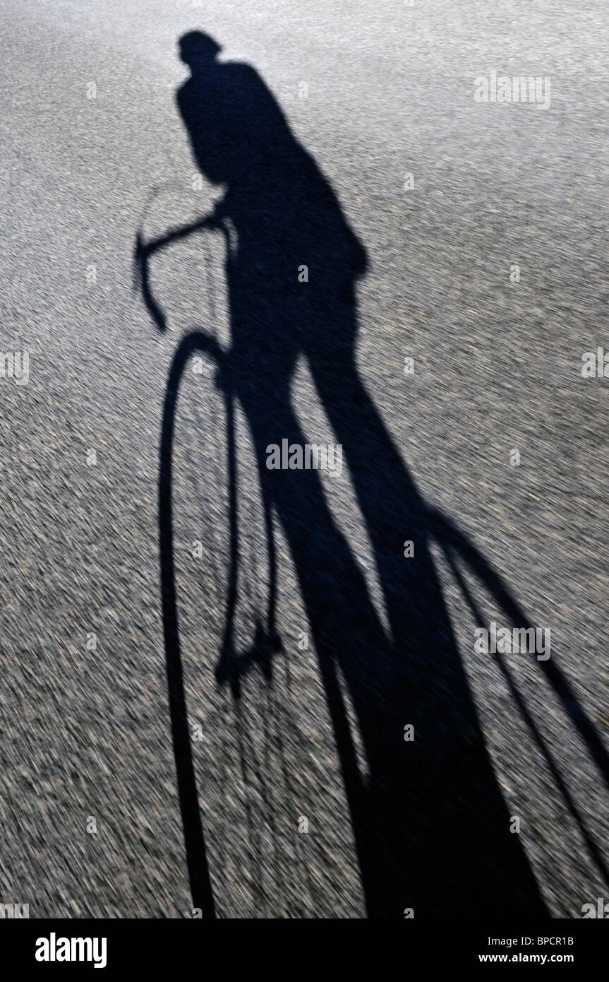 Shadow on road surface of cyclist and bicycle - France Stock Photo - Alamy