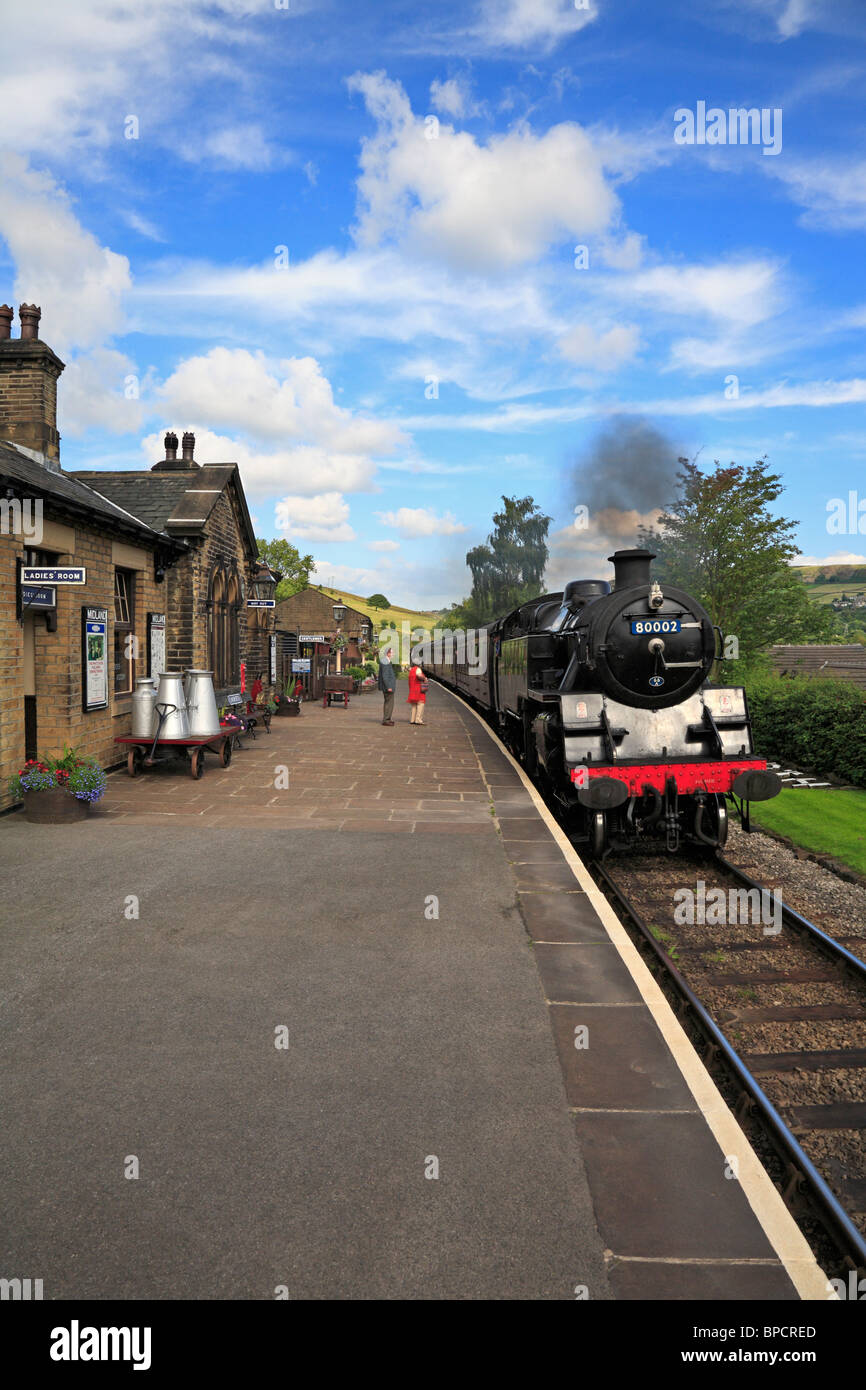Steam train arriving at Oakworth Railway Station, Keighley and Worth ...