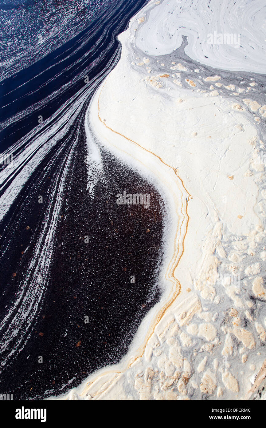 Layer of waste floating on water surface Stock Photo - Alamy