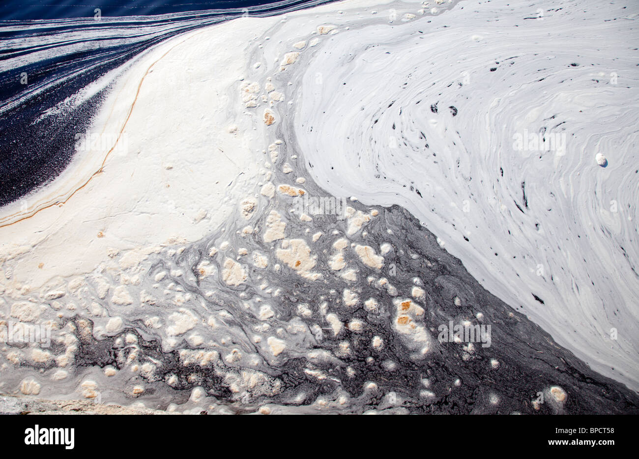 Layer of waste floating on water surface Stock Photo - Alamy