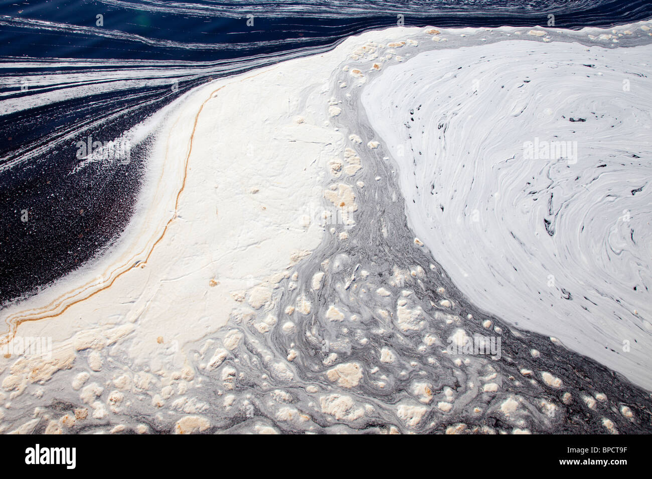 Layer of waste floating on water surface Stock Photo - Alamy