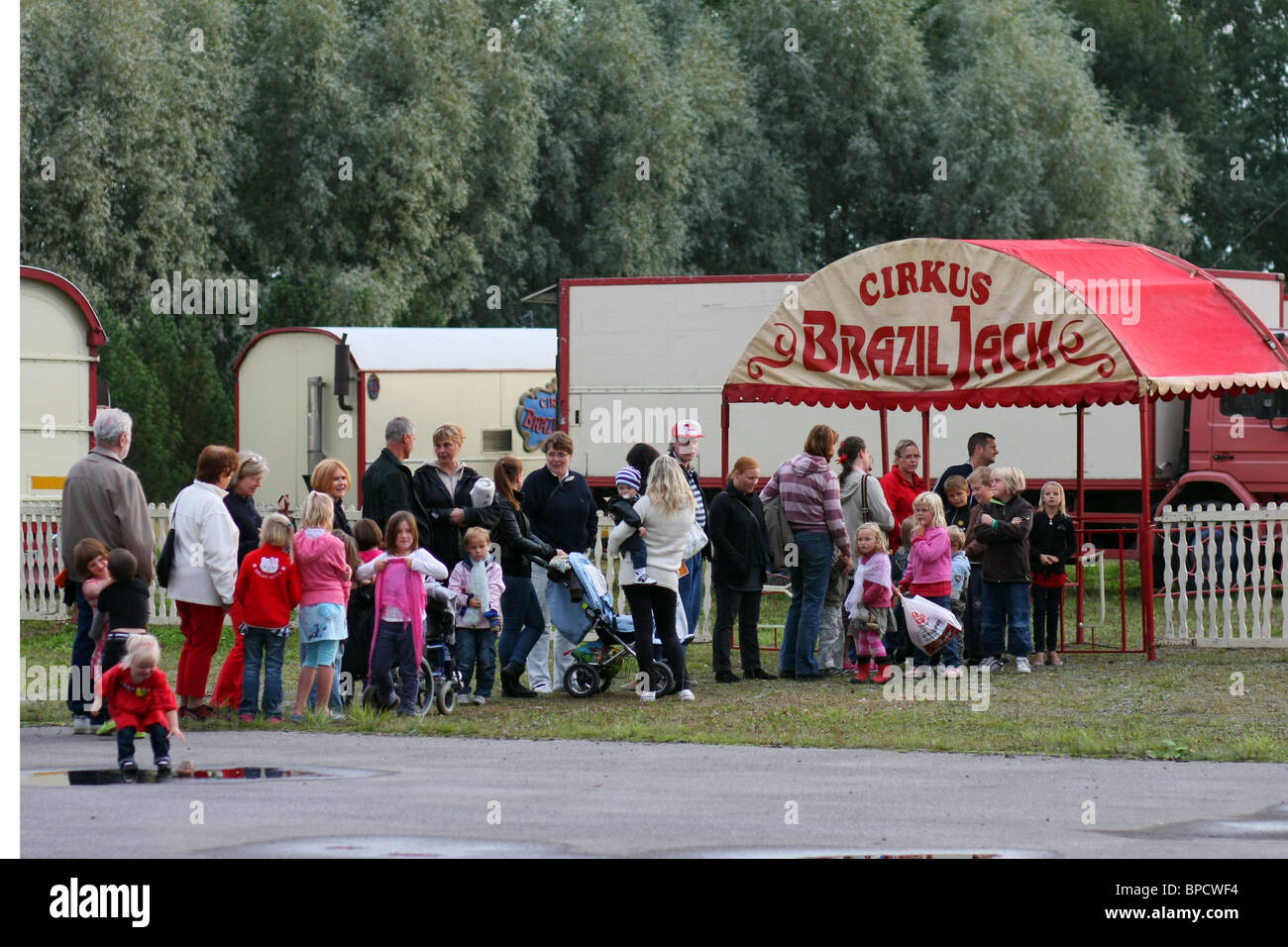 People standing in a queue to the entrance to Circus Brazil Jack Stock ...