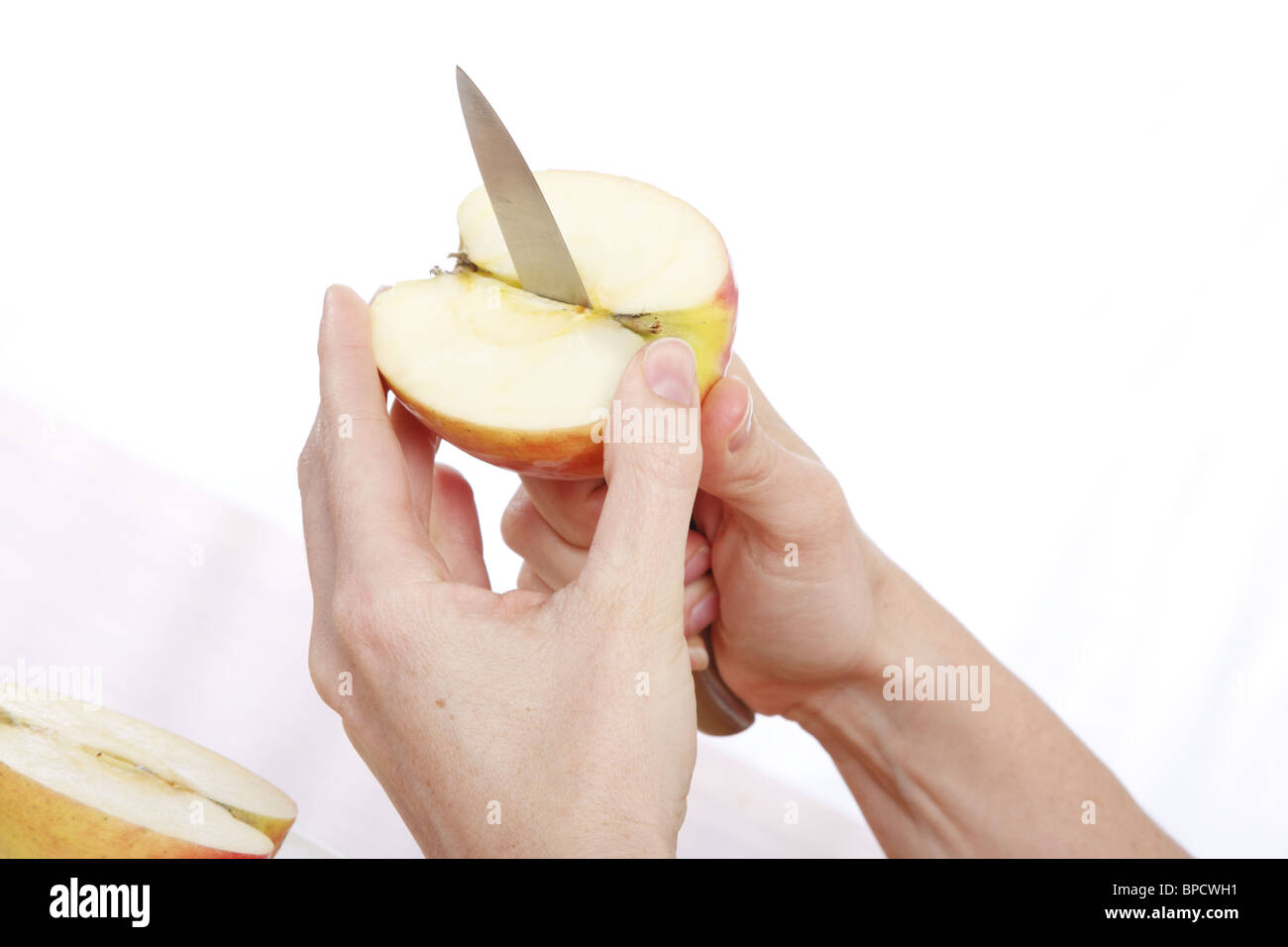 Hands slicing an apple Stock Photo - Alamy