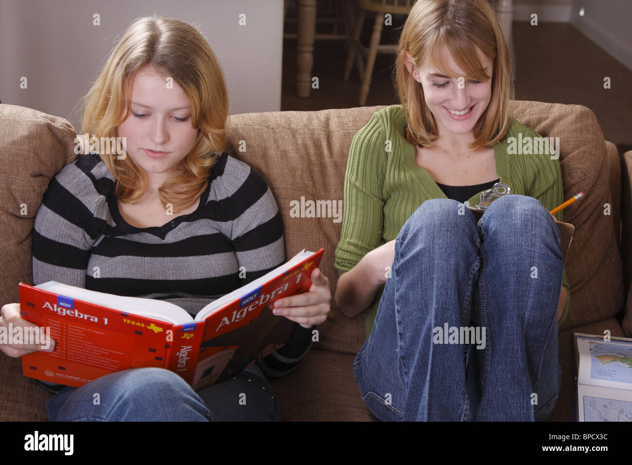Teens doing homework Stock Photo - Alamy