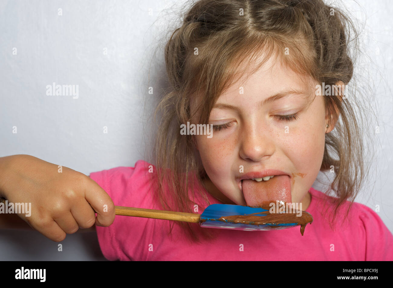 Child Licking Chocolate Spoon High Resolution Stock Photography and ...