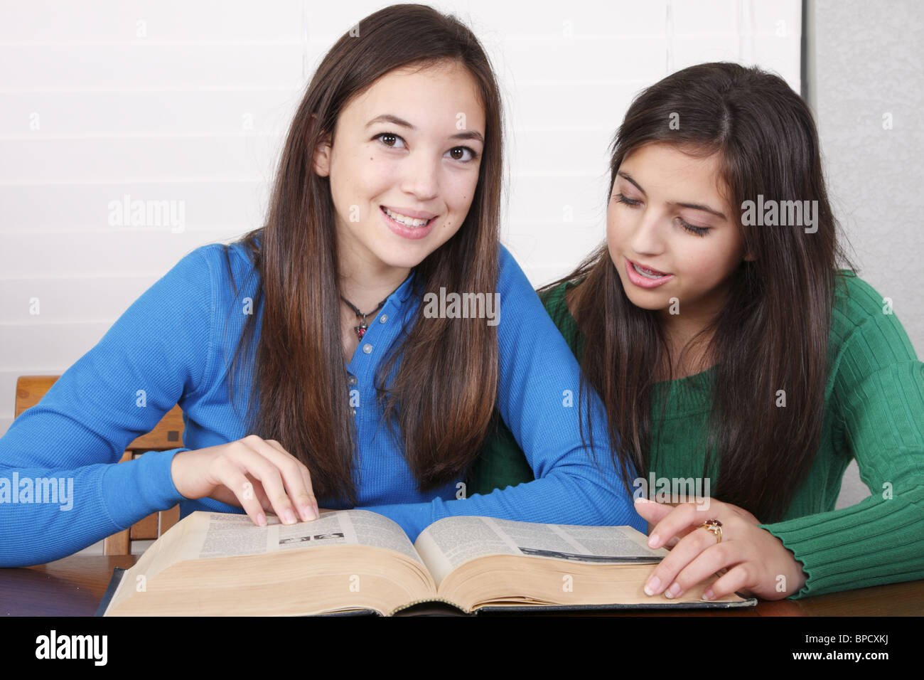 Teens doing homework Stock Photo - Alamy