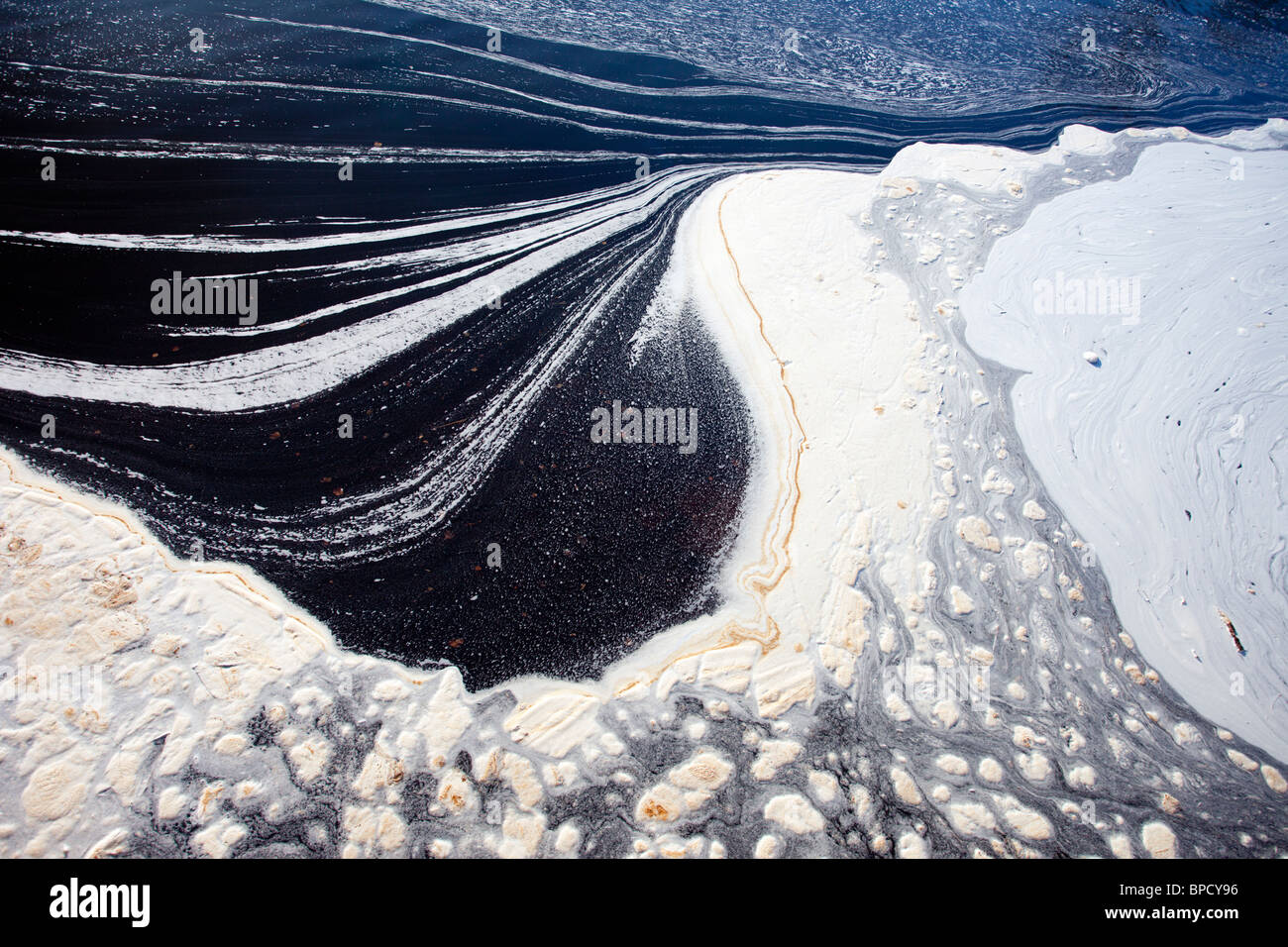 Layer of waste floating on water surface Stock Photo - Alamy
