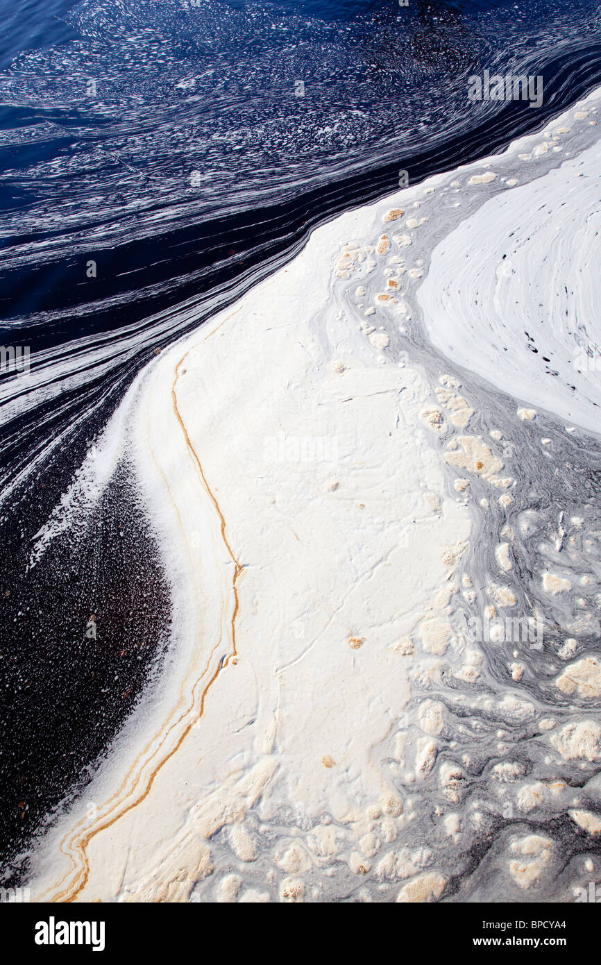 Layer of waste floating on water surface Stock Photo - Alamy