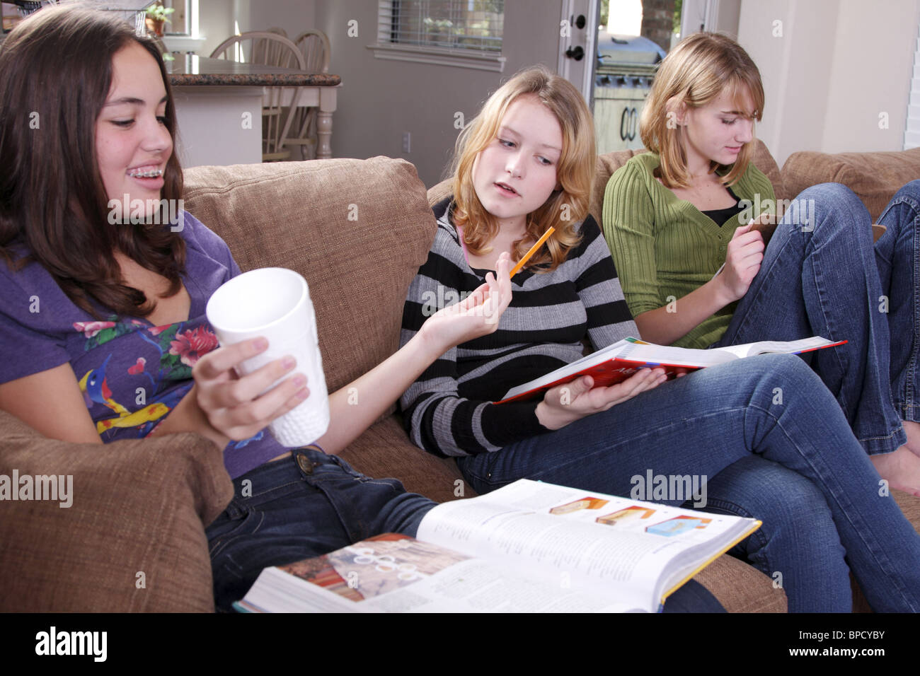 Teens doing homework Stock Photo - Alamy