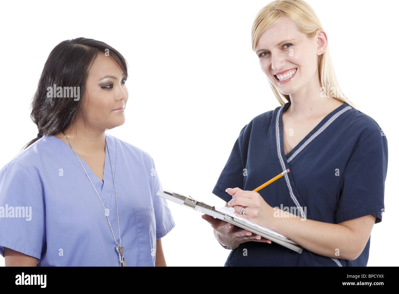 Medical staff going over patient chart Stock Photo - Alamy