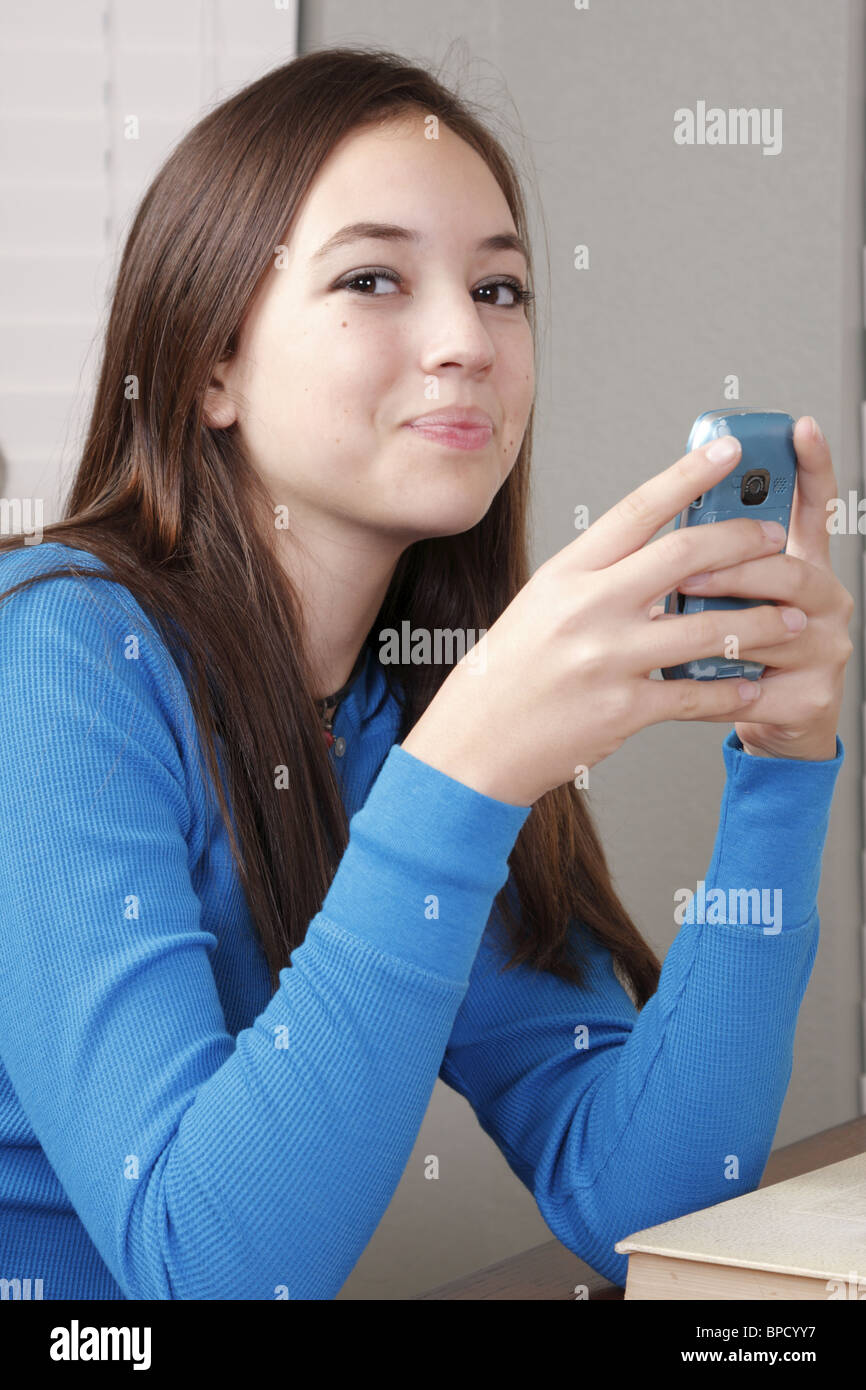 Teenage girl looking text messages hi-res stock photography and images ...