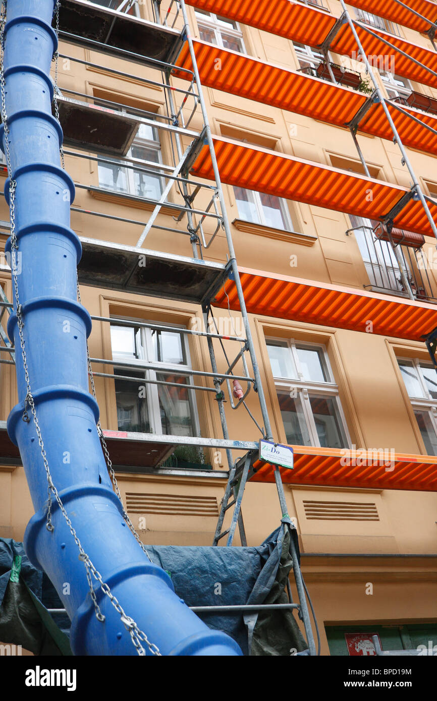 A debris chute and a scaffolding Stock Photo - Alamy