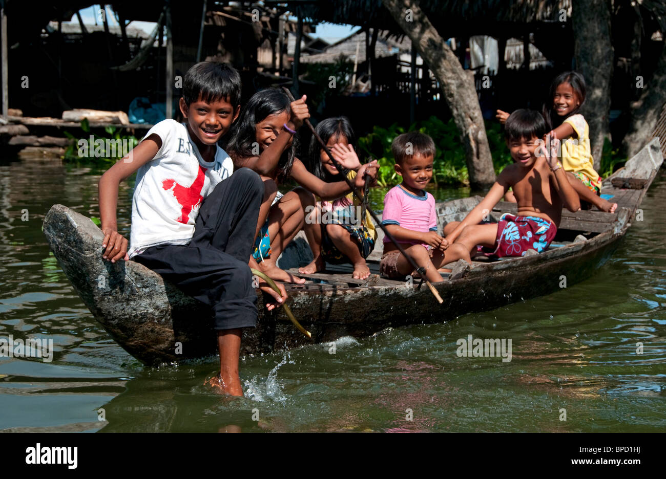Children in a boat hi-res stock photography and images - Alamy