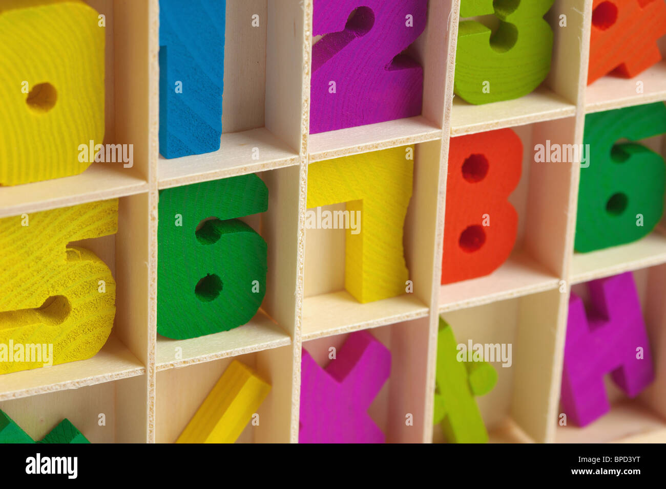 Color wooden toy figures in a box close up Stock Photo - Alamy