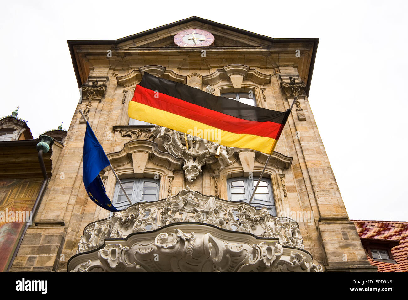 The German national flag flies from a balcony on the Rathaus (Town Hall ...