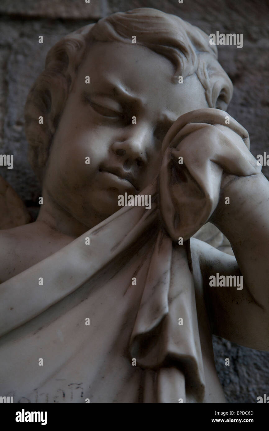 Marble statue on a memorial of a child crying, Chichester Cathedral ...
