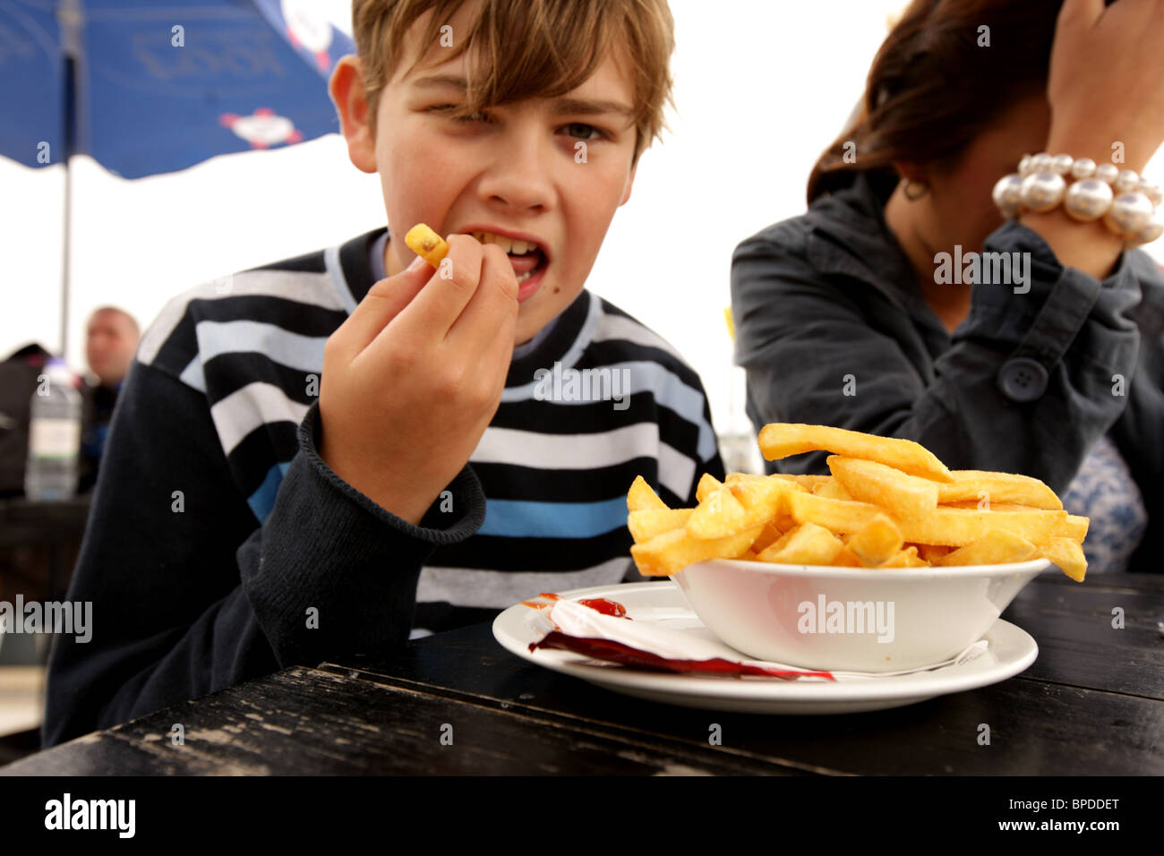 Child Eating Chips Stock Photo - Alamy