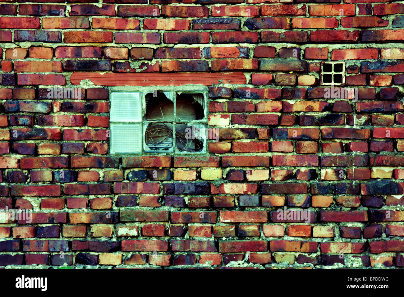 Broken window in red brick wall Stock Photo - Alamy