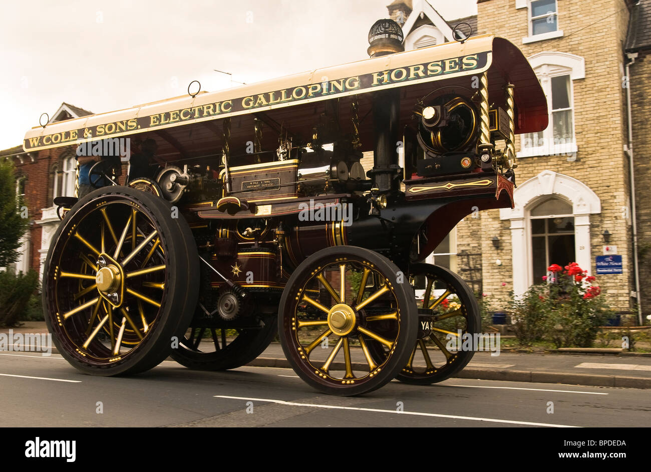 A vintage steam traction engine parades through streets during the 2009 ...