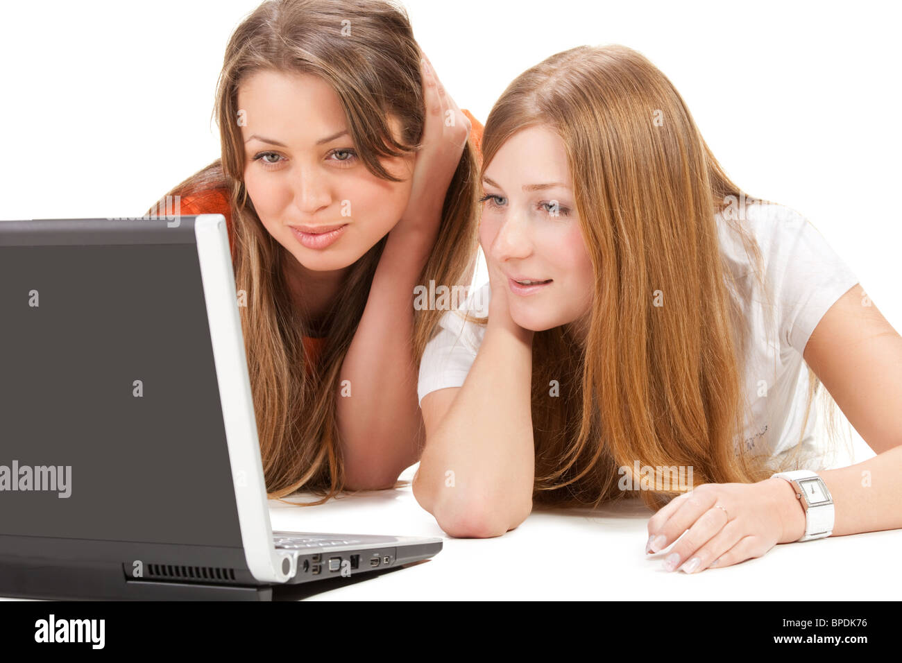 two young happy student girl work on laptop computer isolated on white ...