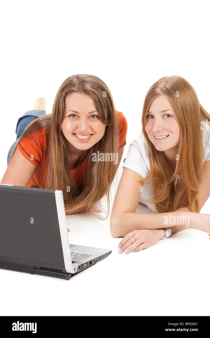 two young happy student girl work on laptop computer isolated on white ...
