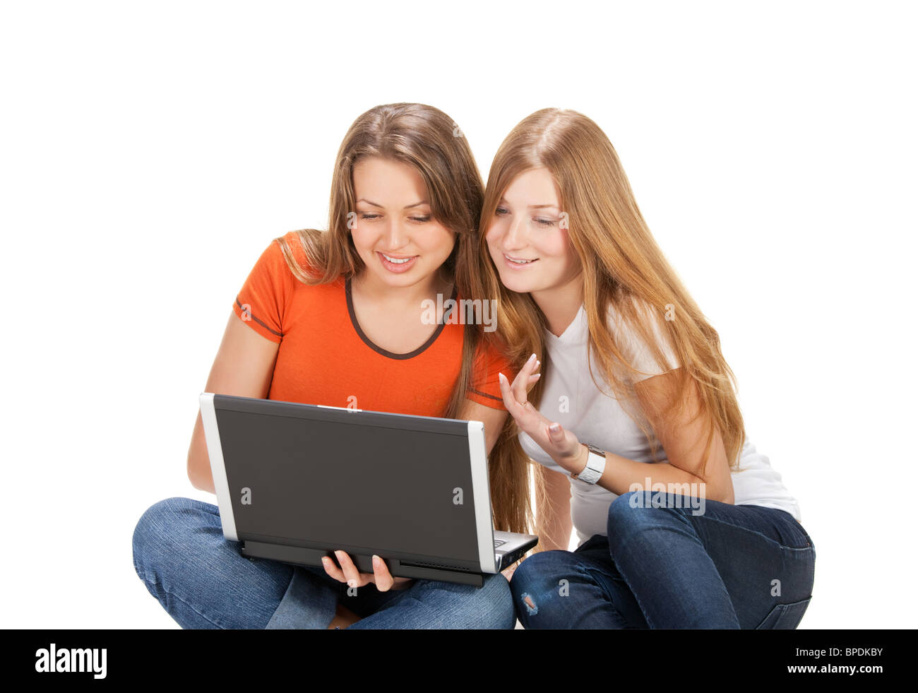 two young happy student girl work on laptop computer isolated on white ...