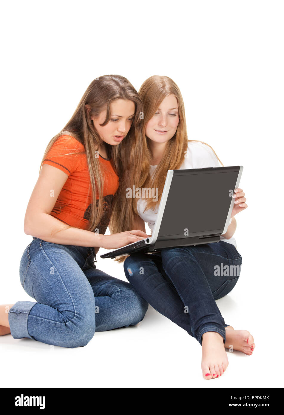 two young happy student girl work on laptop computer isolated on white ...