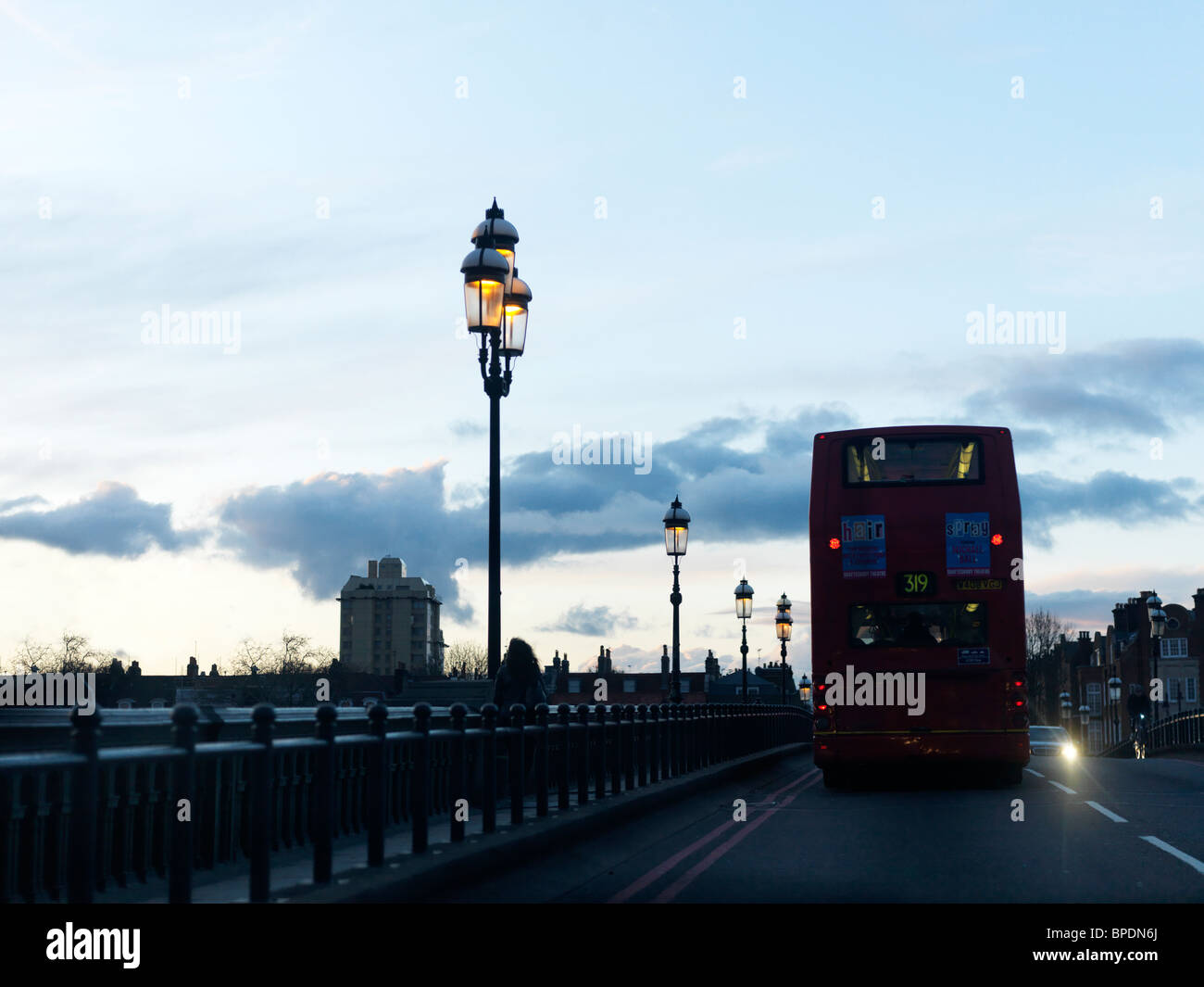 London England Bus Going Over Battersea Bridge In The Evening Stock ...