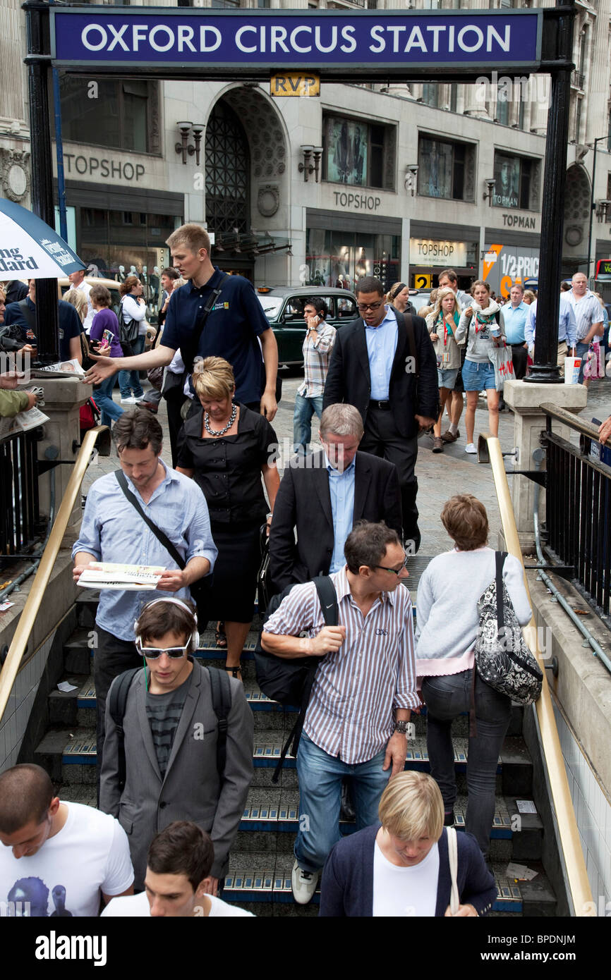 Shoppers enter a busy Oxford Circus underground station, London, UK ...