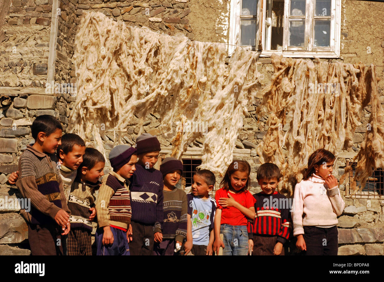 Azerbaijan, Xinaliq, view of young children standing together in a row ...