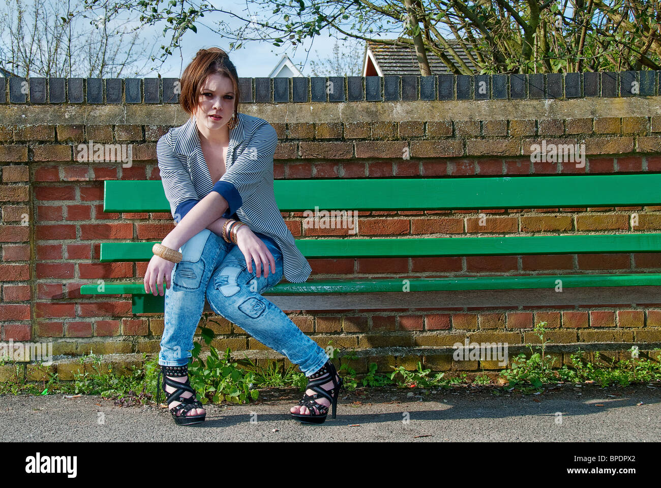 woman on bench Stock Photo - Alamy