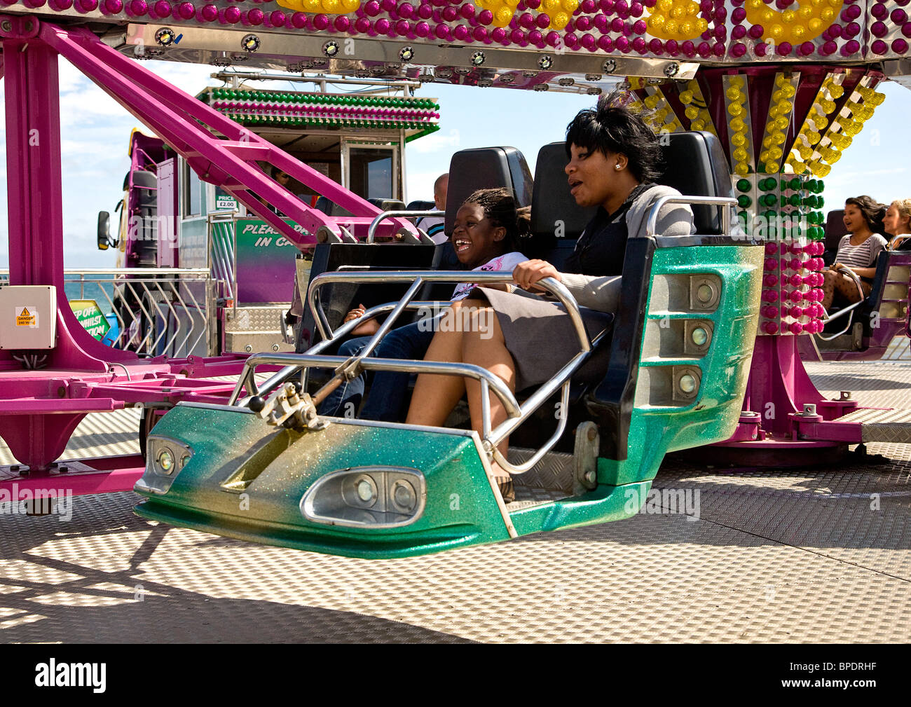 Photo of a fairground ride showing the tension and excitement of the ...