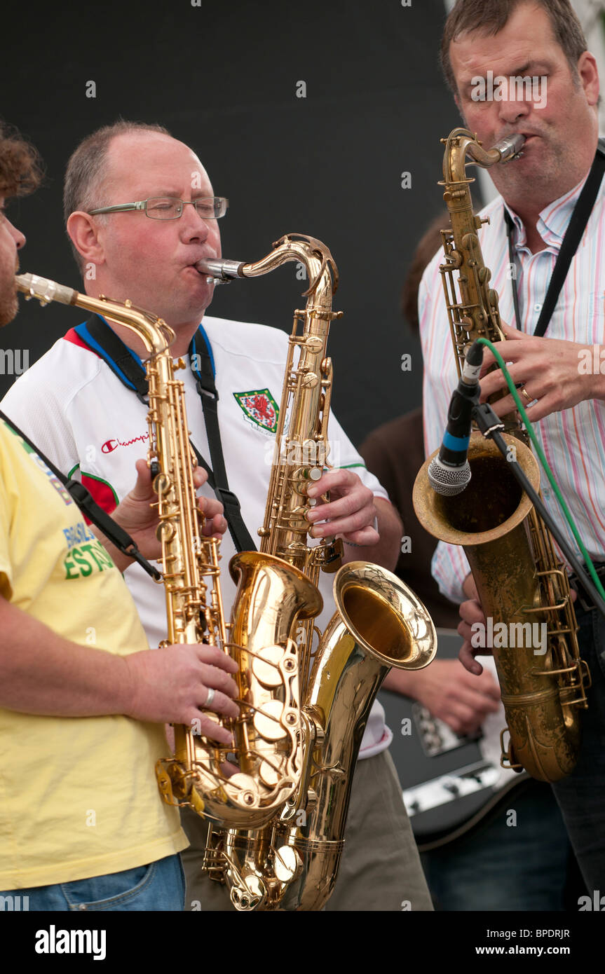 Three men playing jazz saxophones at The National Eisteddfod of Wales ...