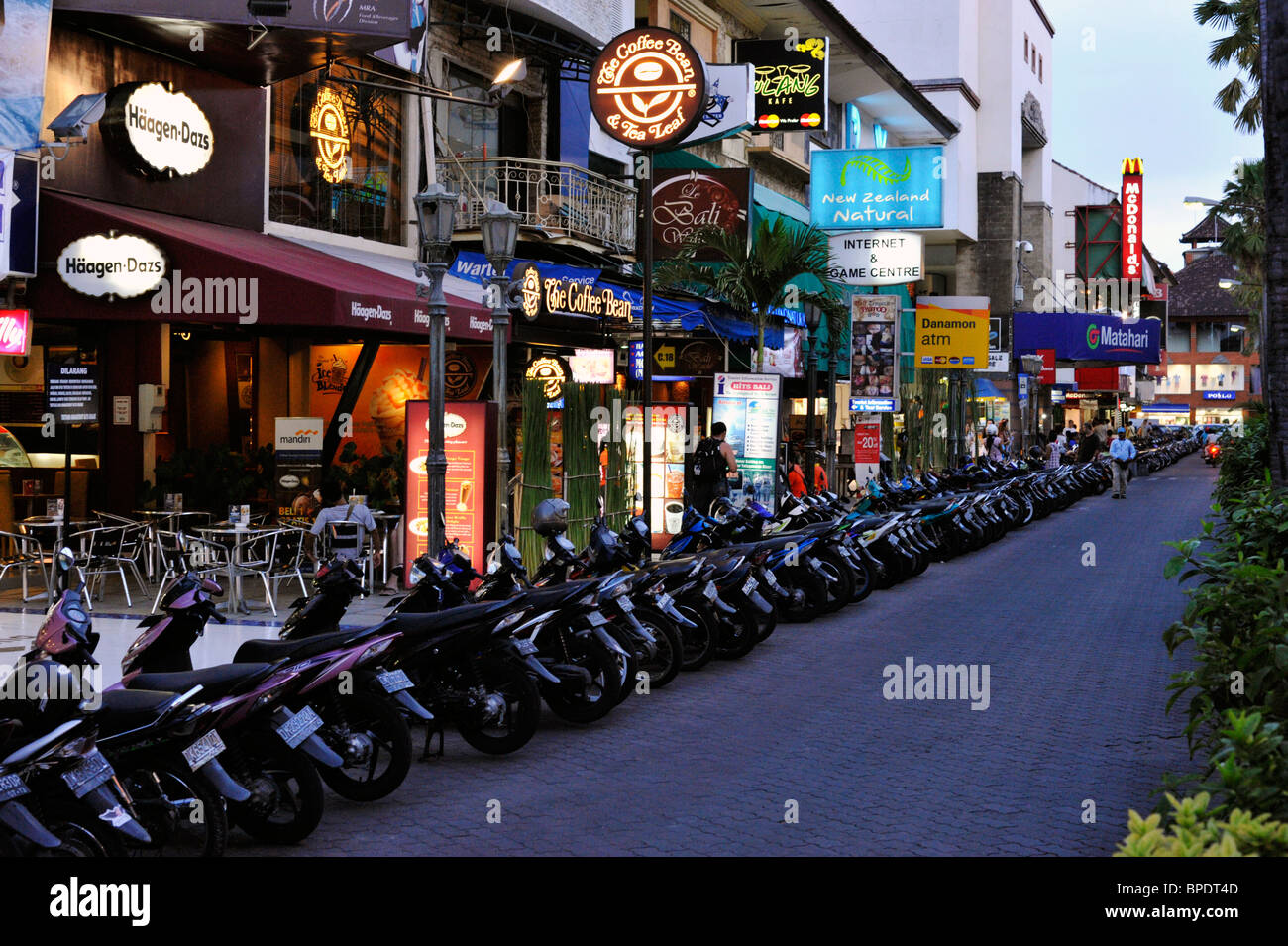 neon lights come on as evening falls in kuta square kuta bali Stock ...
