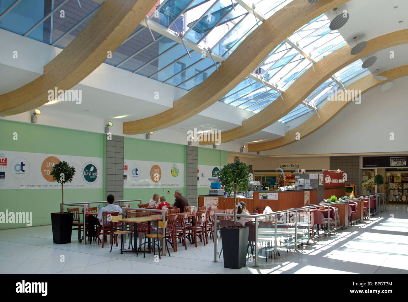 The Baytree Centre shopping mall interior with cafe and shop units ...